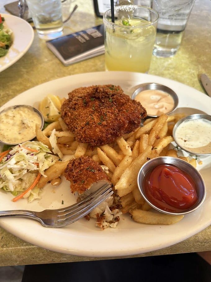 Golden-crusted fish and chips that would make a British pub jealous, served with enough dipping sauces to satisfy even the most indecisive condiment enthusiast.