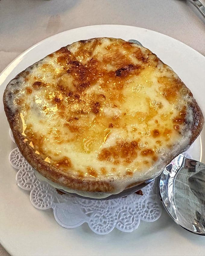 This French onion soup isn't just a dish—it's an event. The cheese pull alone deserves its own standing ovation.