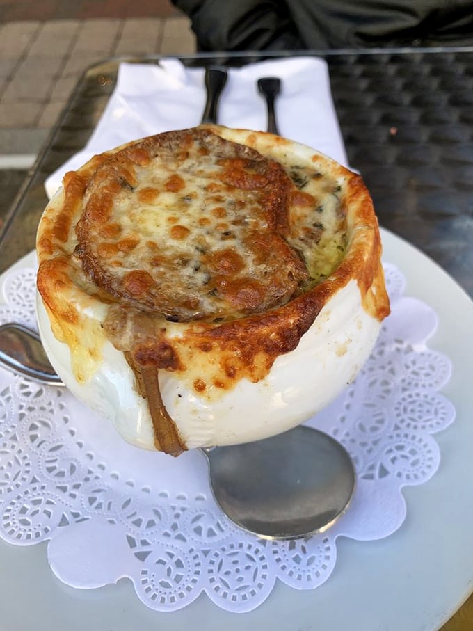 Behold the crown jewel – a bubbling masterpiece of caramelized onions and molten cheese that makes all other soups feel like they're not even trying.