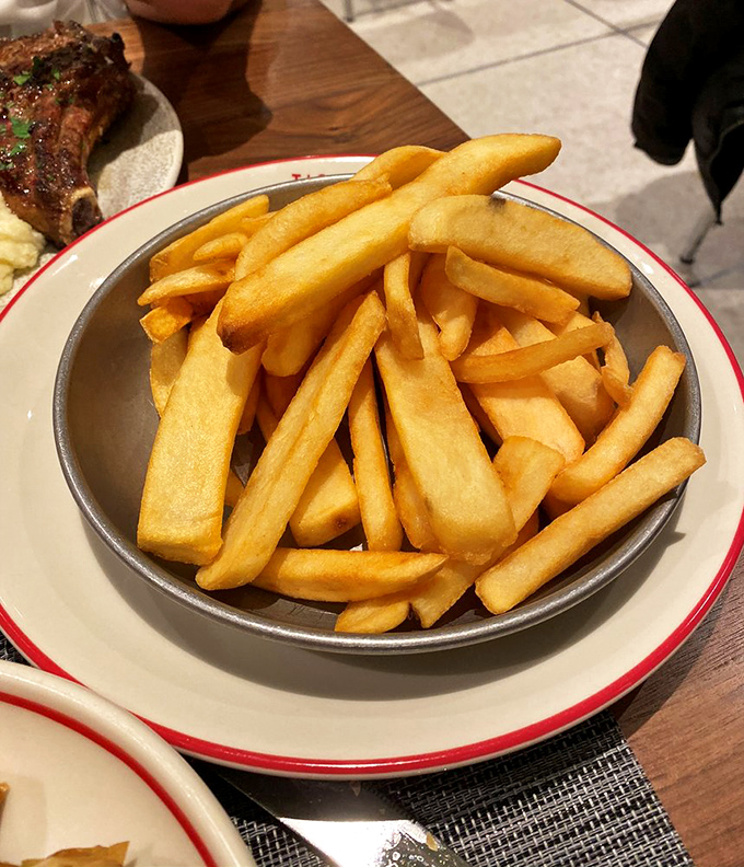 Golden ratio perfected: these French fries hit that magical balance between crispy exterior and fluffy interior that makes mathematicians weep with joy.