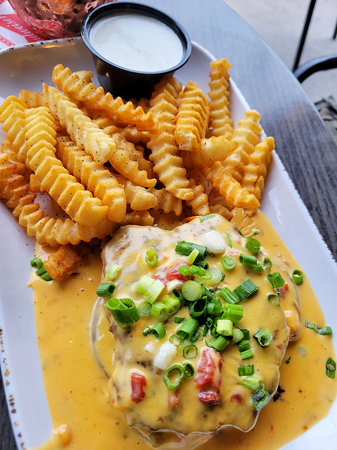 These aren't just crinkle-cut fries—they're ridged potato masterpieces designed to maximize sauce-to-spud ratio. That cheese sauce could make cardboard taste good.