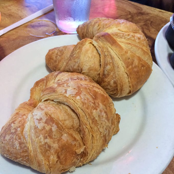 Golden, flaky croissants that shatter into buttery shards with each bite—proof that simple pleasures are often the most profound.