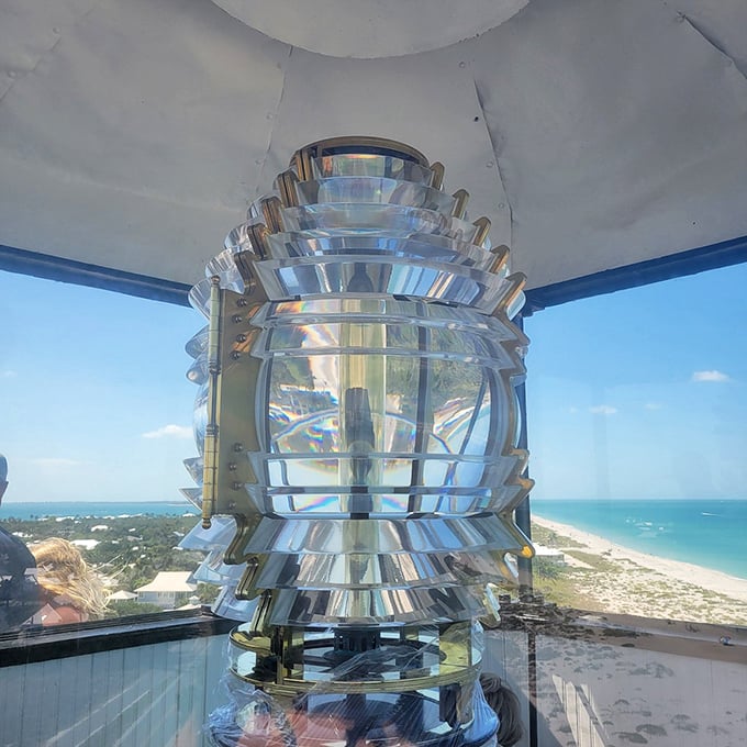 Engineering marvel meets artistic beauty. This Fresnel lens doesn't just guide ships—it transforms sunlight into a kaleidoscope of colors that dance across the lighthouse interior.