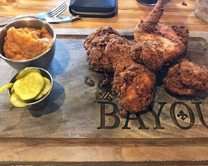 Fried chicken that makes time stand still. That golden-brown crust protecting juicy meat is what food dreams are made of, served with pickles and sweet potato mash.