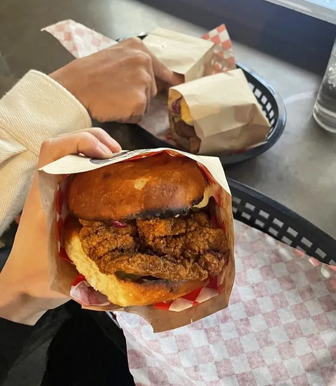 Behold the star of the show! This fried chicken sandwich isn't just food—it's an edible love letter to crispy perfection.