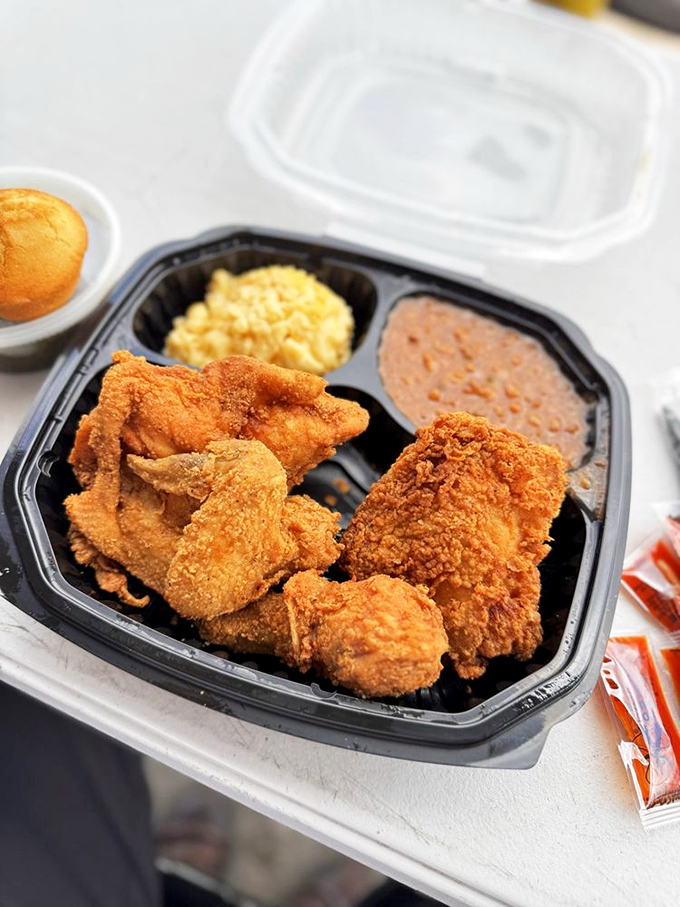 Golden-brown perfection that makes Colonel Sanders look like an amateur. The mac and cheese and beans aren't sides—they're worthy companions on this flavor journey.