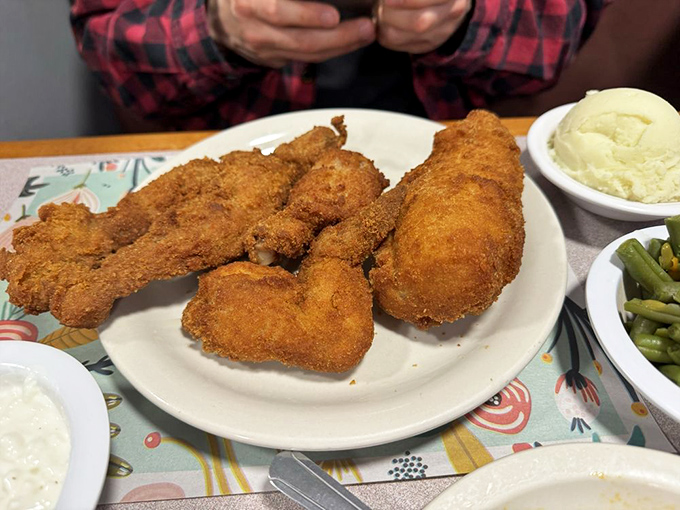 Golden-brown perfection that makes you understand why people drive for hours. This isn't just fried chicken; it's edible heritage.