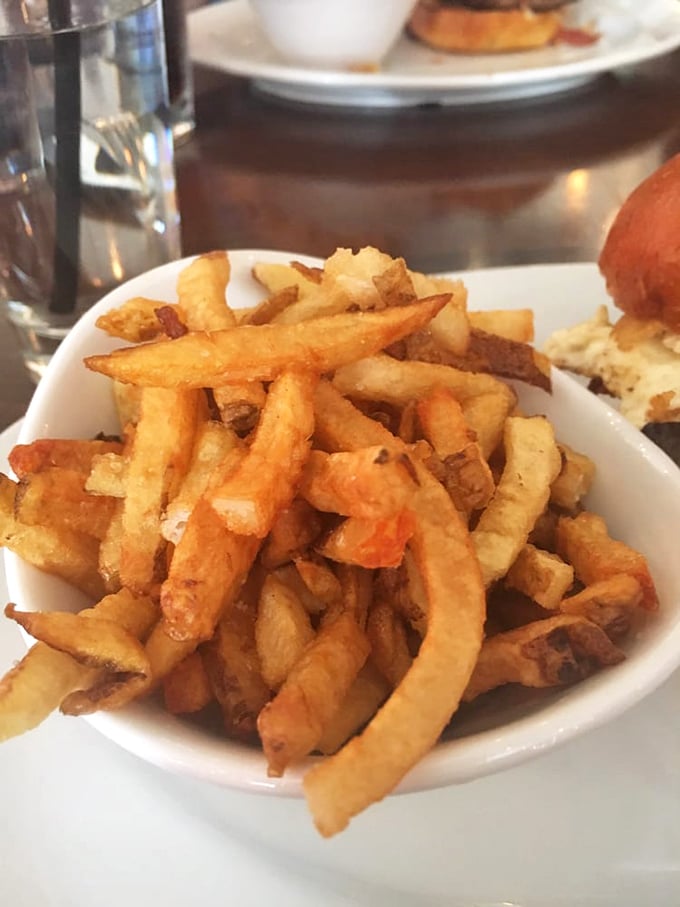 Golden, crispy perfection in a bowl. These fries aren't merely a side dish—they're the supporting actor that steals the show.