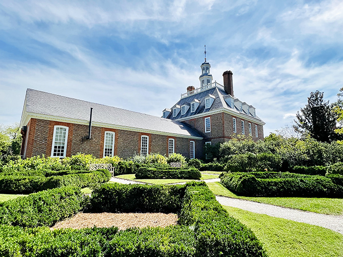 The Governor's Palace stands regally amid meticulously manicured hedges—the 18th-century equivalent of saying "my topiary game is stronger than yours."