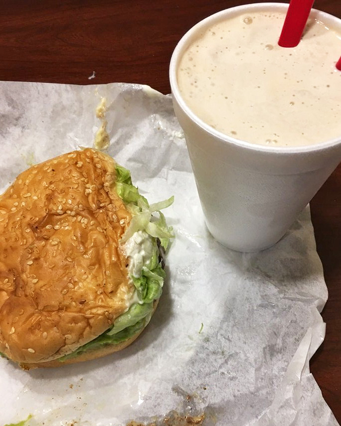 The dynamic duo of American cuisine: a perfectly dressed burger alongside a shake so thick it defies gravity. Name a more iconic pairing—I'll wait.