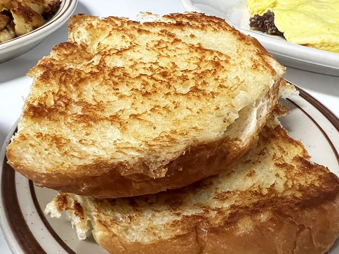 Golden-brown perfection that makes store-bought bread seem like a cruel joke. This toast doesn't need avocado to be the star.