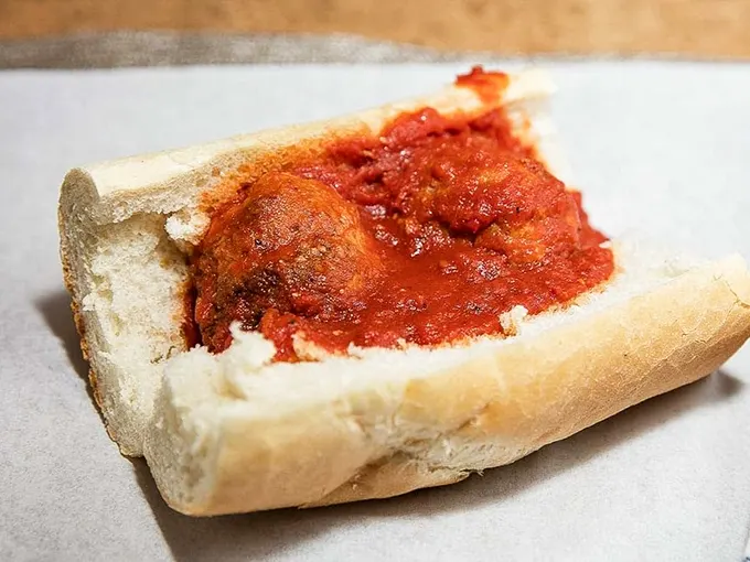 These meatballs aren't just swimming in marinara—they're doing the backstroke in flavor country. Napkins required, no exceptions.