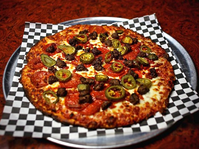 This isn't just pizza—it's a thin-crust masterpiece topped with pepperoni, jalapeños, and olives that delivers a spicy symphony in every perfectly crisp bite.