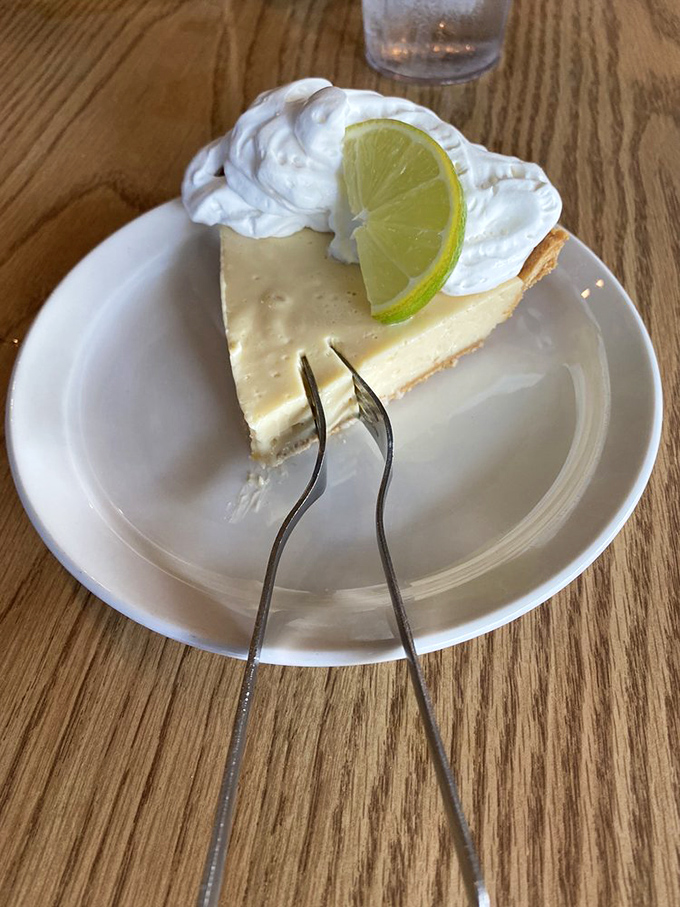 Key lime pie that strikes the perfect balance between tart and sweet. That dollop of whipped cream and lime slice isn't just garnish – it's the exclamation point on Florida's signature dessert. 
