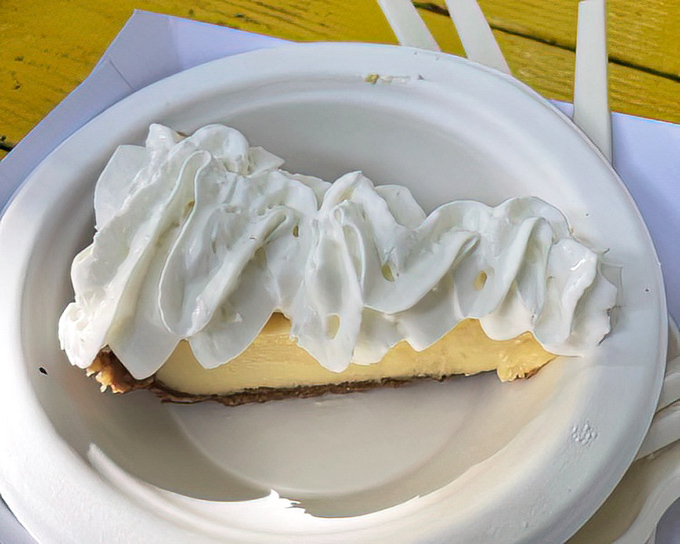 This slice of Key lime pie isn't just dessert—it's Florida on a plate, with a cloud of whipped cream that deserves its own weather report.