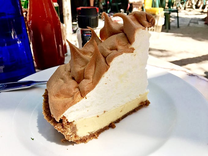 The infamous mile-high meringue on Blue Heaven's key lime pie isn't just dessert—it's a fluffy, tangy landmark that's worth crossing state lines for.