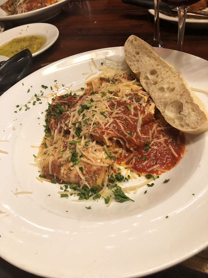 Lasagna that doesn't just sit on the plate—it poses, showing off its layers of perfection and that telltale cheese pull that haunts your dreams.