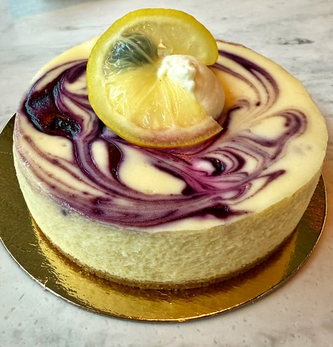 The lemon blueberry cheesecake doesn't just satisfy a sweet tooth—it tells a story of summer in every swirled, vibrant bite.