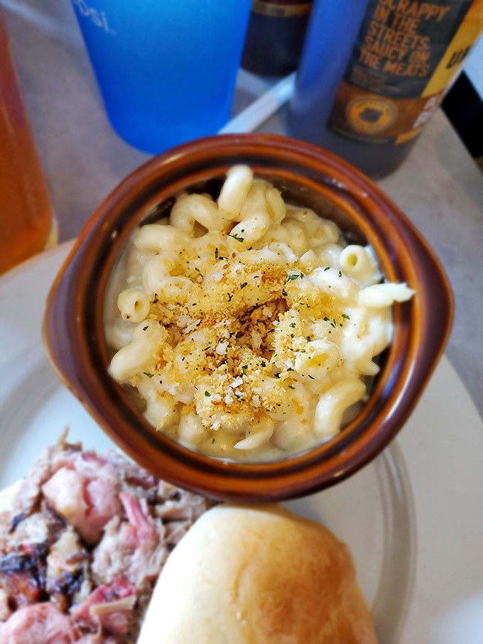This isn't just mac and cheese—it's a creamy, golden pool of comfort topped with a crumbly crown fit for barbecue royalty.