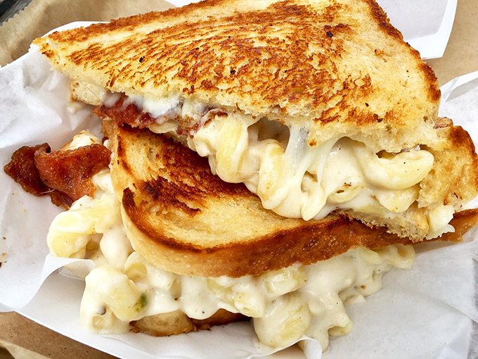 The mac and cheese grilled cheese defies sandwich physics – somehow combining two perfect comfort foods into something even greater.