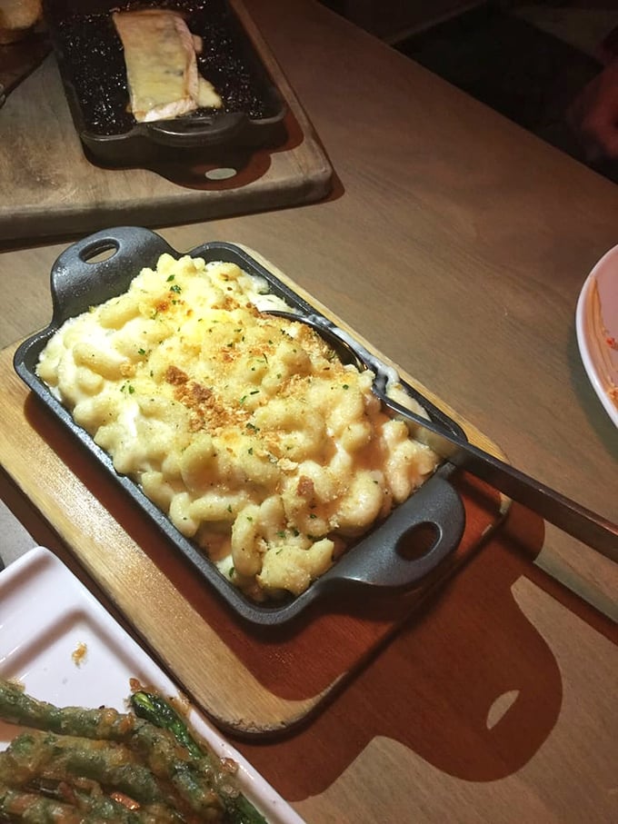 Mac and cheese that's achieved celebrity status in its own cast iron cocoon. This isn't your childhood version—unless you grew up in culinary heaven.
