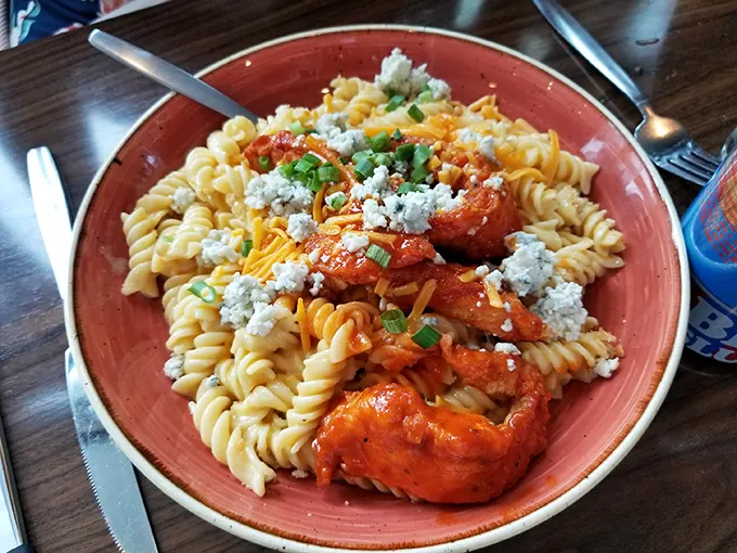 Buffalo chicken mac and cheese that makes you question why anyone would ever separate these soulmates. The blue cheese crumbles are the wedding officiant.