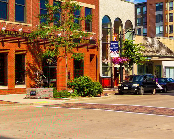 The Willow Creek sign beckons from warm brick walls that have witnessed decades of downtown life. This isn't manufactured charm—it's the real Wisconsin deal.
