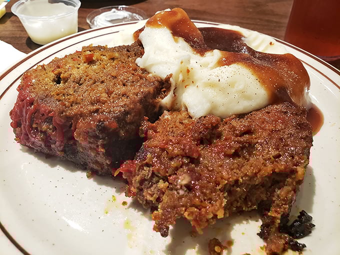 Meatloaf that would make your grandmother both jealous and proud. The gravy doesn't just cover the mashed potatoes—it embraces them like a long-lost friend.