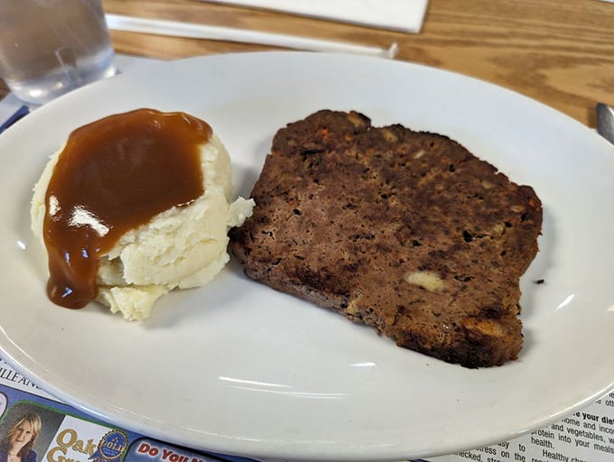 Meatloaf that would make your grandmother both jealous and proud, served with mashed potatoes drowning in gravy—as nature intended.