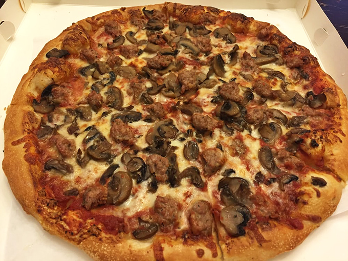 This isn't just pizza—it's a masterclass in toppings distribution. Every bite of mushroom and sausage promises the perfect flavor ratio.