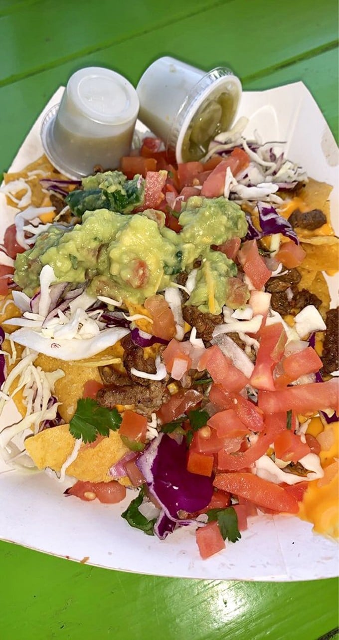 Nachos that require a topographical map to navigate – mountains of guacamole, valleys of cheese, and forests of fresh toppings.