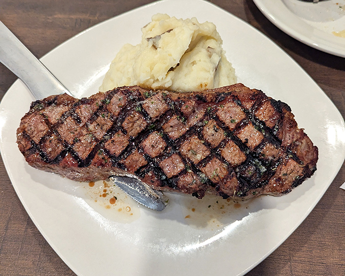 Behold the star of the show—a perfectly grilled New York Strip with textbook grill marks and a side of creamy mashed potatoes. Meat lovers, your prayers have been answered.