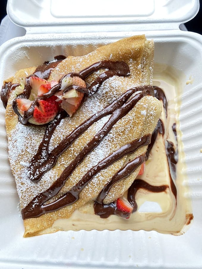 This Nutella crepe isn't just breakfast—it's an event. Fresh strawberries and chocolate drizzle make resistance futile.
