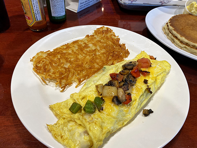 This veggie omelet doesn't just satisfy hunger – it reconciles your healthy intentions with your comfort food cravings in one perfect yellow package.