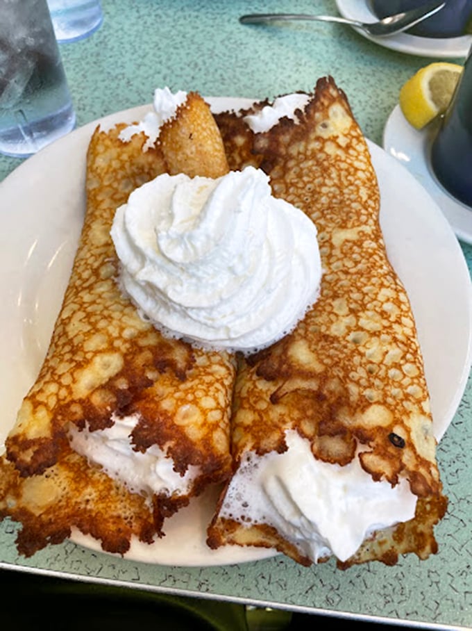 Behold the famous crepe-like hotcakes in their natural habitat – crispy-edged, whipped cream-topped wonders that have seduced presidents.