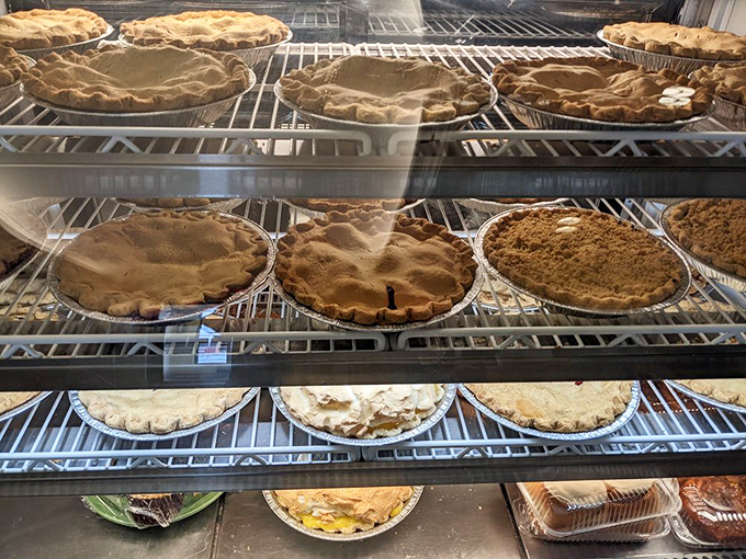 Pie paradise found! Each golden-crusted masterpiece sits patiently waiting its turn to become the highlight of someone's day—or their Instagram feed.