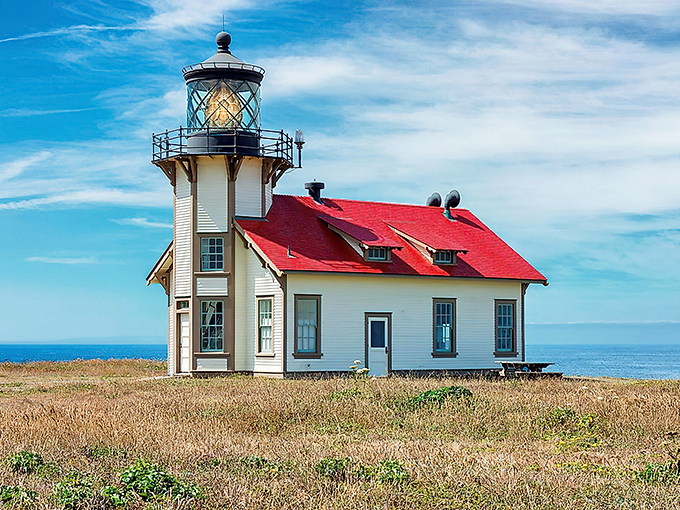 Point Cabrillo Light Station stands like a maritime sentinel in a red-roofed tuxedo, guiding ships and Instagram influencers alike since 1909.
