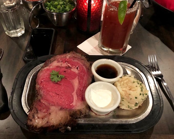The prime rib arrives like a meaty masterpiece—perfectly pink, accompanied by jus that should be classified as a controlled substance.