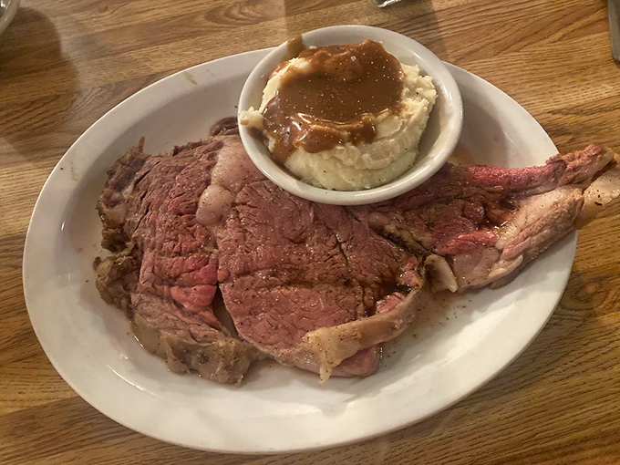 This prime rib isn't just dinner—it's a religious experience. The perfect pink center surrounded by that seasoned crust might just make you weep with joy.