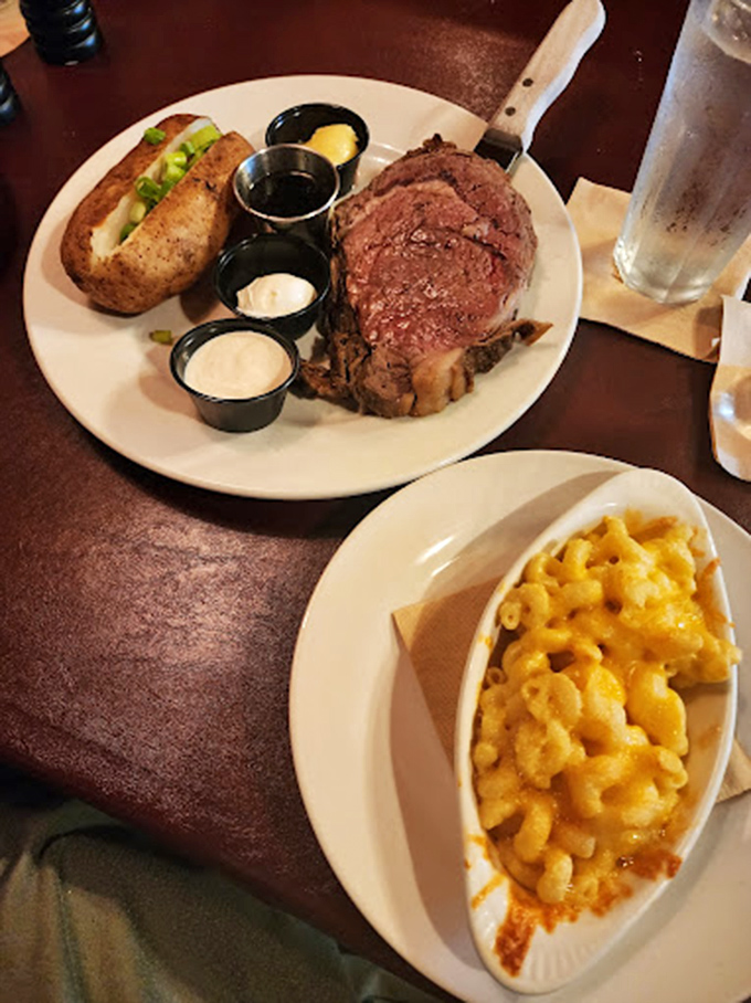 Prime rib that doesn't need a filter—perfectly pink, served with a loaded baked potato and mac and cheese that would make your childhood self high-five your adult self.