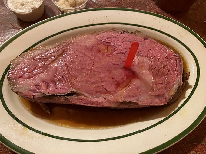 This prime rib isn't just dinner—it's a pink-centered masterpiece that makes vegetarians question their life choices from across the room.