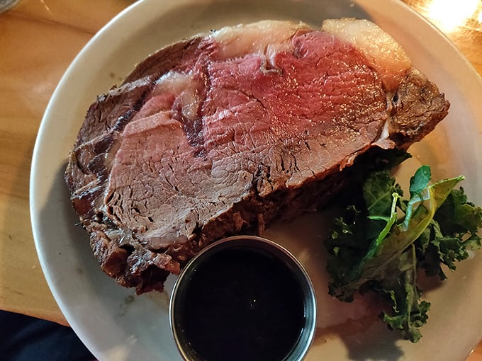 This prime rib isn't just dinner; it's a carnivore's dream that's been slow-roasted to the kind of perfection that makes vegetarians question their life choices.