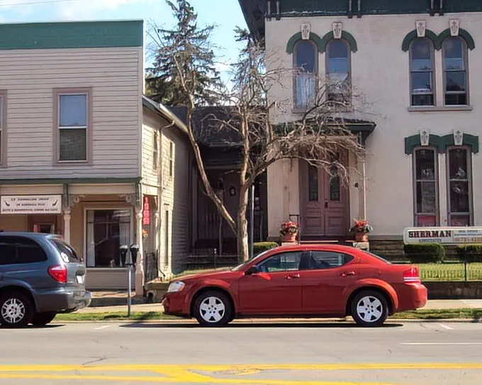 Victorian and Italianate buildings stand shoulder to shoulder, their different architectural personalities somehow creating the perfect neighborhood rather than a stylistic argument.