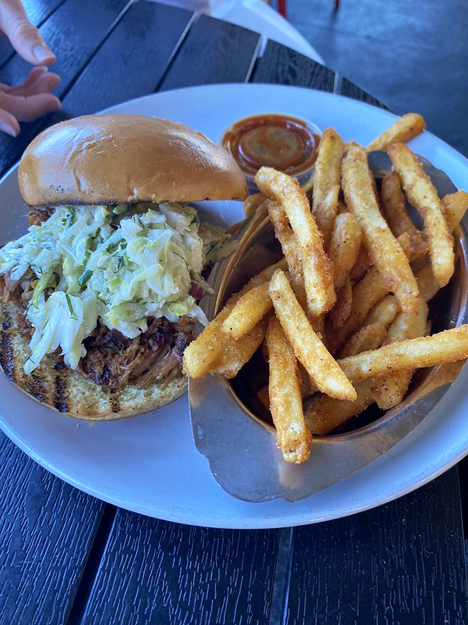 This pulled pork sandwich isn't just a meal, it's a statement of purpose – proof that happiness can indeed be served on a bun.