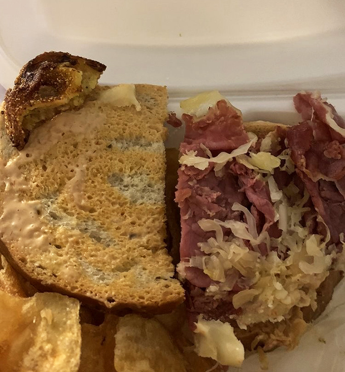 This isn't just a Reuben; it's a masterpiece of balance – the corned beef, sauerkraut, and Russian dressing performing a perfect culinary tango on rye.