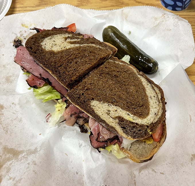 This isn't just a sandwich—it's architecture. Layers of tender corned beef, sauerkraut, and melted Swiss create the Reuben equivalent of the Taj Mahal.