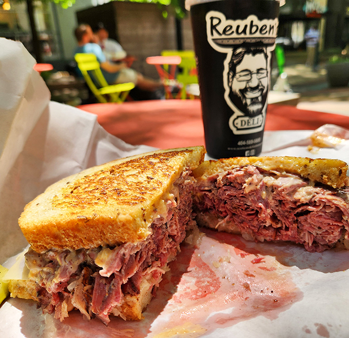 This isn't just a sandwich; it's a masterpiece of meat architecture—layers of corned beef stacked between perfectly toasted rye bread.