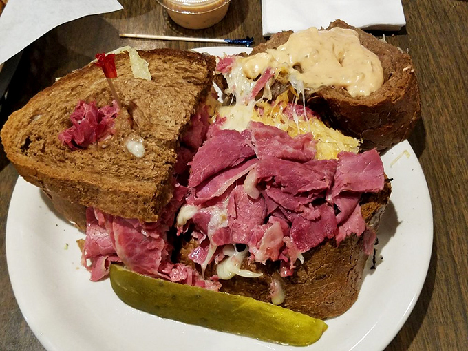This isn't just a Reuben sandwich – it's a skyscraper of corned beef that requires engineering skills just to take the first bite.