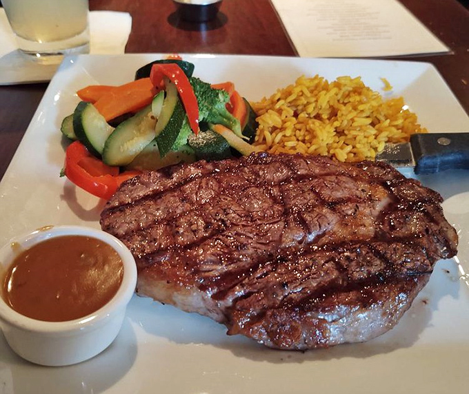 Behold the star of the show—a perfectly grilled rib eye that doesn't just satisfy hunger but creates the kind of food memory you'll reminisce about for years.
