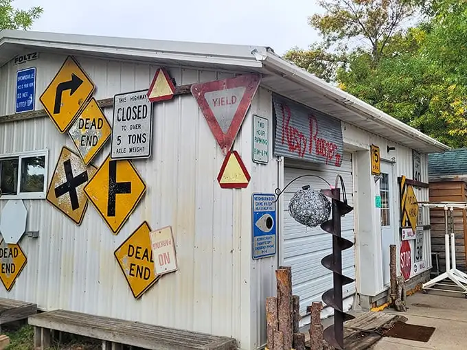 Road sign heaven! This building's exterior serves as a graveyard for retired traffic signs, proving that even "DEAD END" can find new life at Shady Hollow.